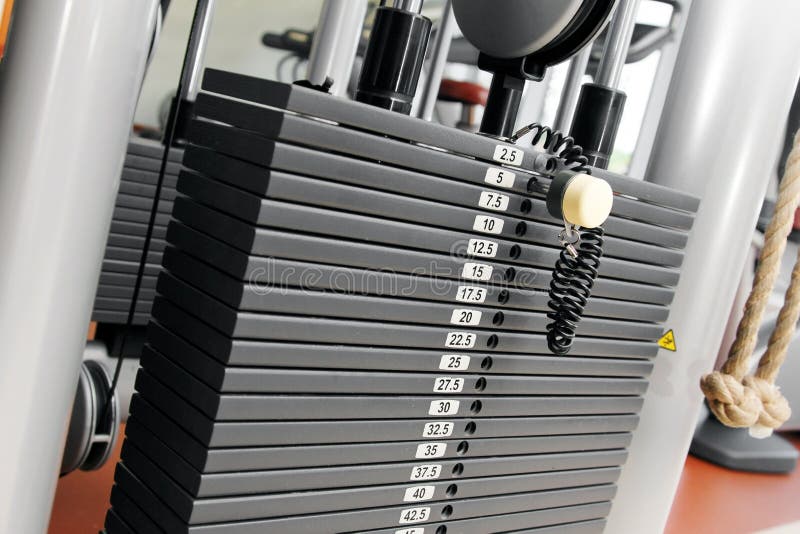 Weight stack in a gym stock image. Image of indoors, facility - 56343059