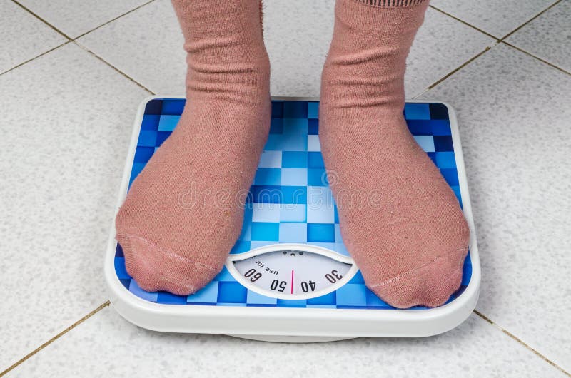 Weight Woman Standing on a Retro Style Weighing Machine Stock Photo ...