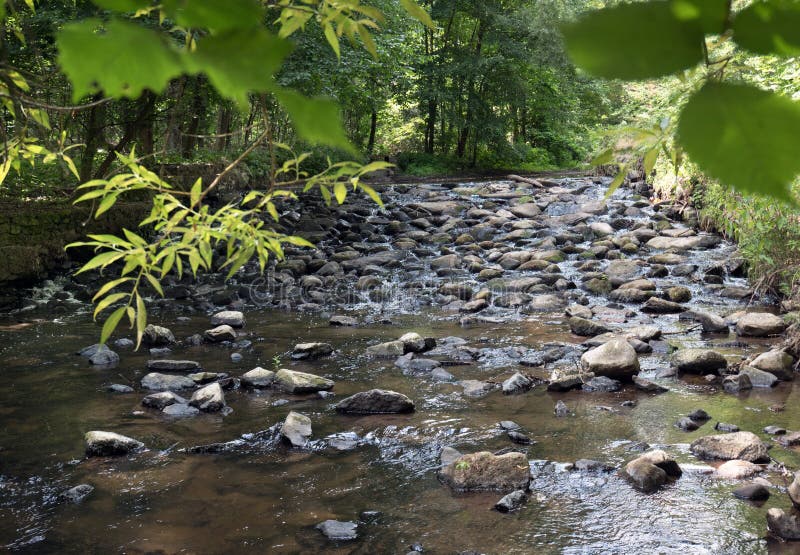 Stone weir on a stream stock photo. Image of hill, step - 174572808