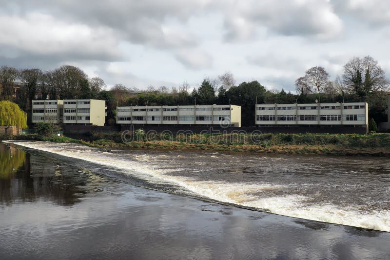 Weir on the River Dee in Chester with Apartments on the Far Bank Stock ...
