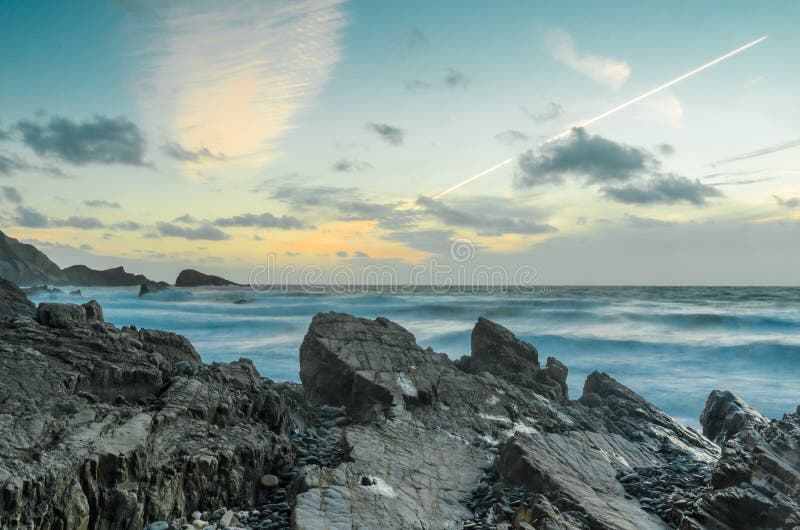 Welcombe Mouth Bay sunset stock image. Image of pebble - 78263175