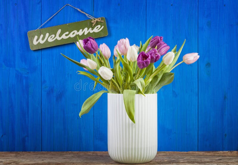 Tulips in Vase and Welcome Sign Stock Image - Image of blue, still ...