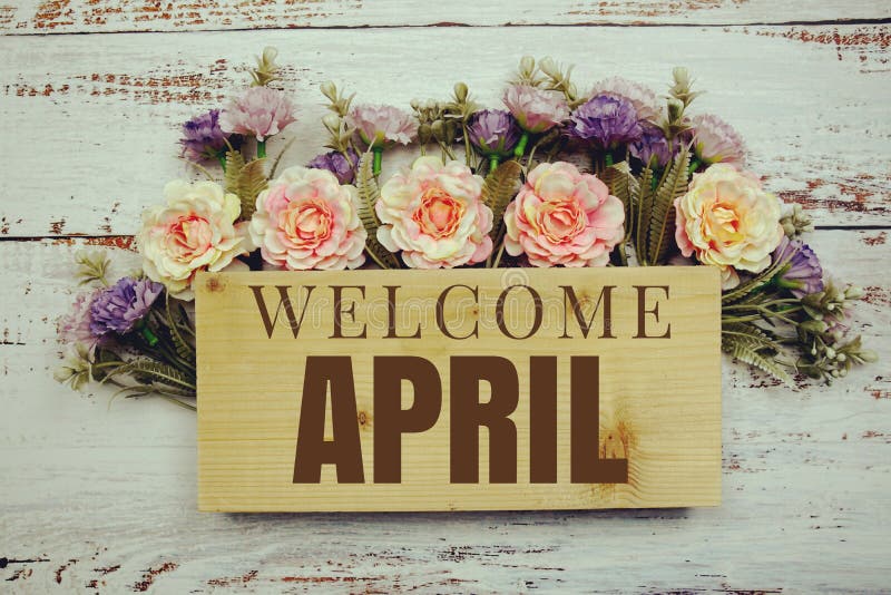 Welcome April Text on Wooden Board with Flowers Frame on Wooden ...