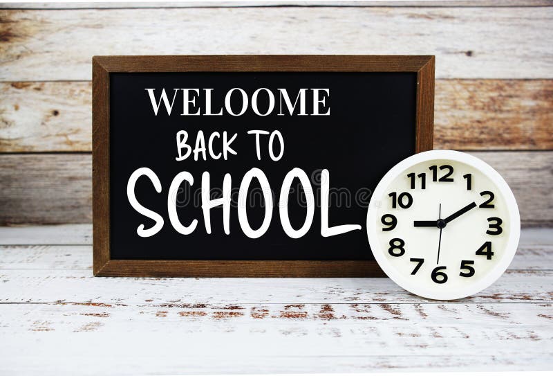 Welcome Back To School Text Write on Chalkboard with White Clock on ...