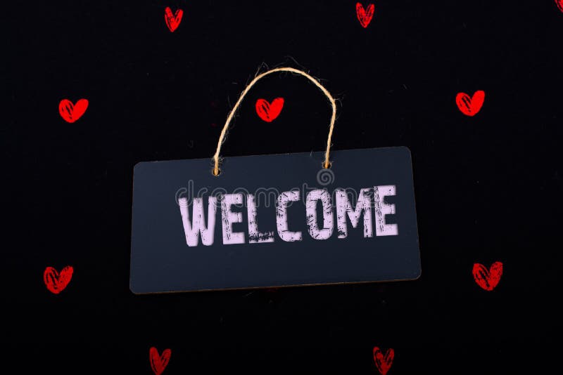 Welcome on Black Notice Board with Red Hearts Around Stock Image ...
