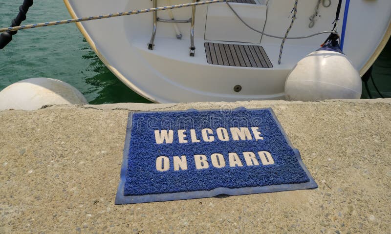 Welcome on Board Text on Carpet Across the Sea and Boat in the Harbour ...