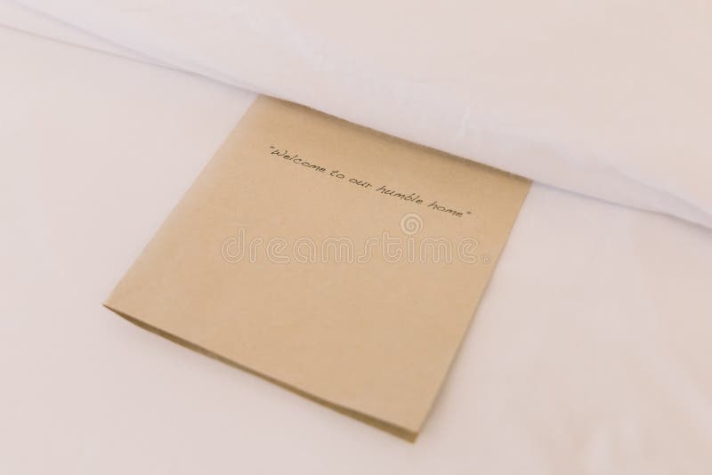 Welcome Card Placed Inside a Hotel Room Bed Stock Photo - Image of ...