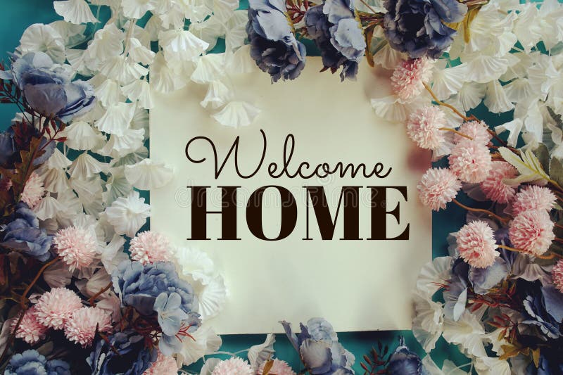 Welcome Home Text with Flowers Frame Decoration Top View on Blue ...