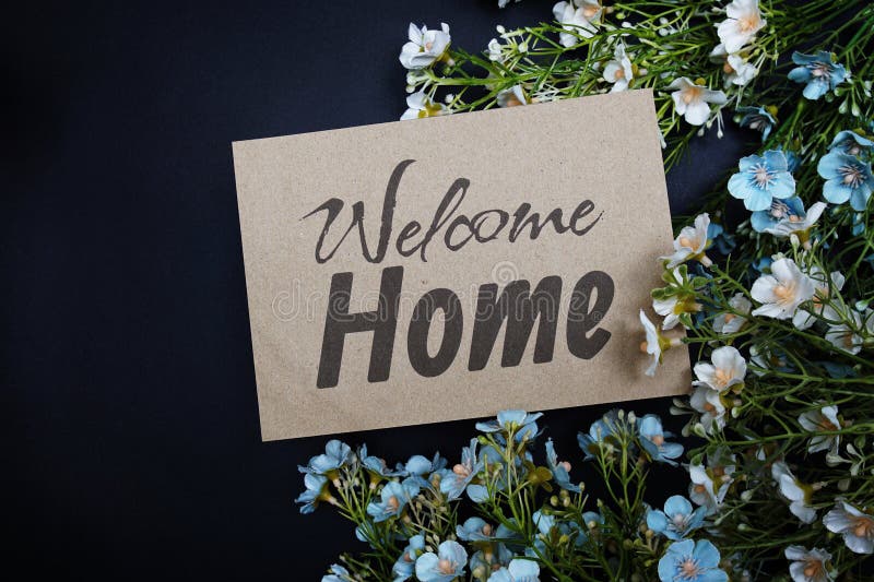 Welcome Home Text Message with Flower Decoration on Black Background ...