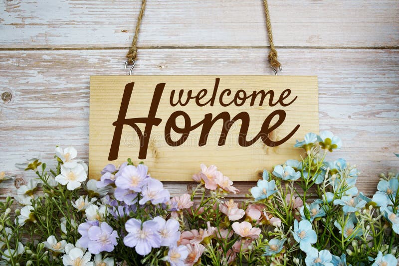 Welcome Home Text with Flowers Frame Decorate on Wooden Background ...
