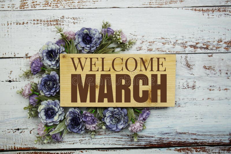 Welcome March Text on Wooden Board with Flowers Frame on Wooden ...