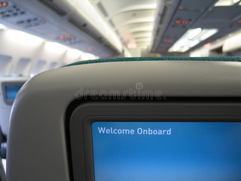 Welcome Message on Screen in Airplane Interior Stock Image - Image of ...