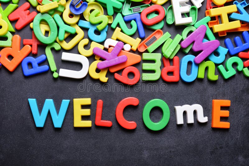 Welcome Message Written with Colorful Plastic Letters on Chalkboard or ...