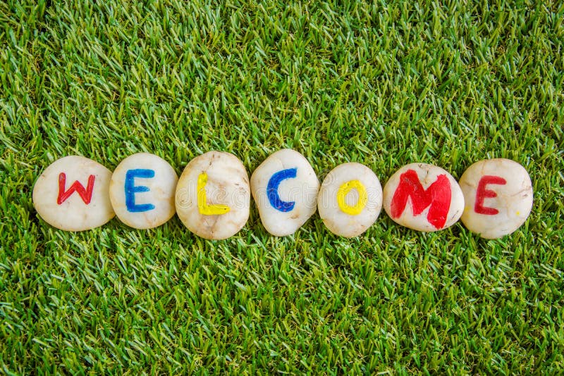 Welcome Paint on Stone , on the Grass Stock Photo - Image of text ...