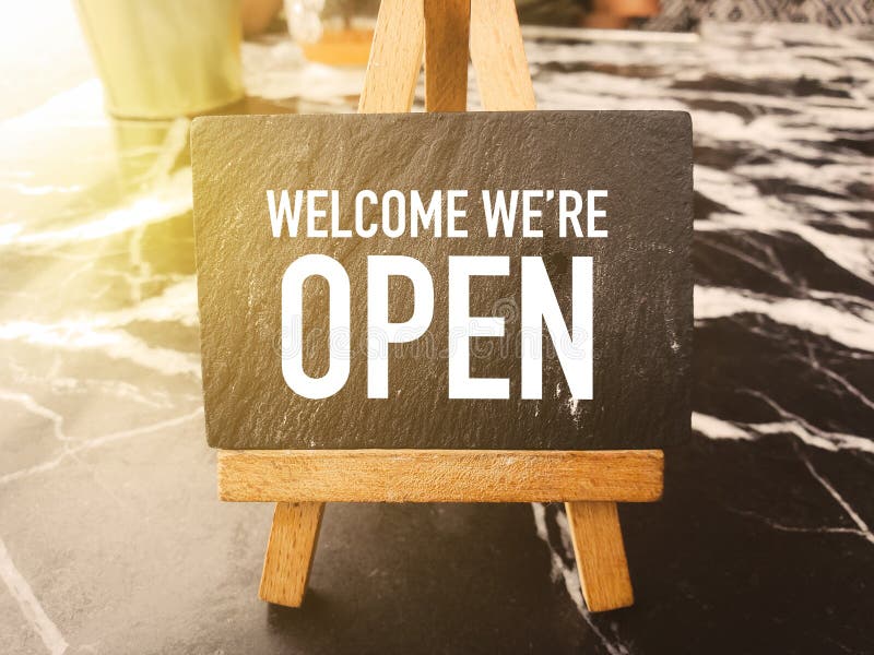 Welcome we Re Open Written on a Chalkboard,Open Sign Broad on Table ...