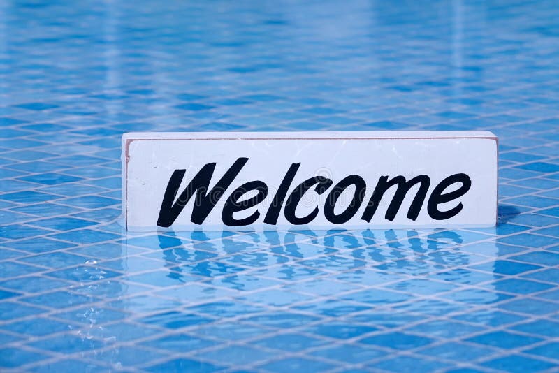 Welcome Sign and Empty Swimming Pool Surface in the Background Stock ...