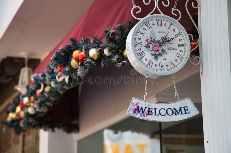 Welcome Sign Hanging on Wall Clock Stock Photo - Image of signboard ...