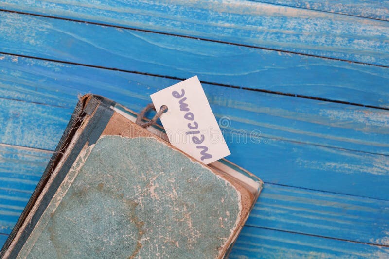 Welcome Sign and Old Book - Vintage Style Stock Photo - Image of ...