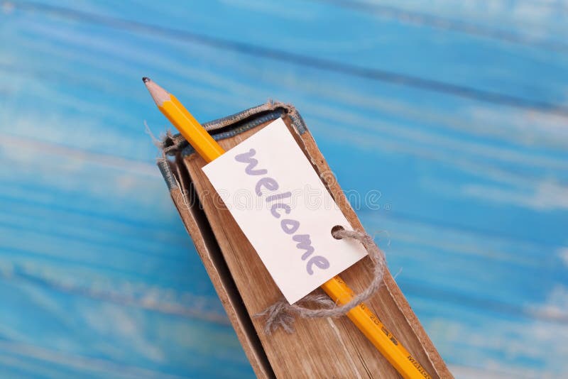 Welcome Sign and Old Book - Vintage Style Stock Photo - Image of ...