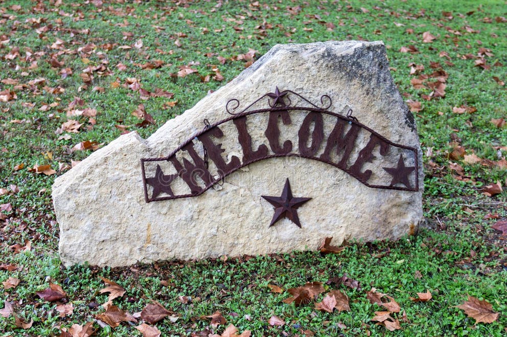Welcome Sign on a Rock stock photo. Image of stars, antique - 62982008