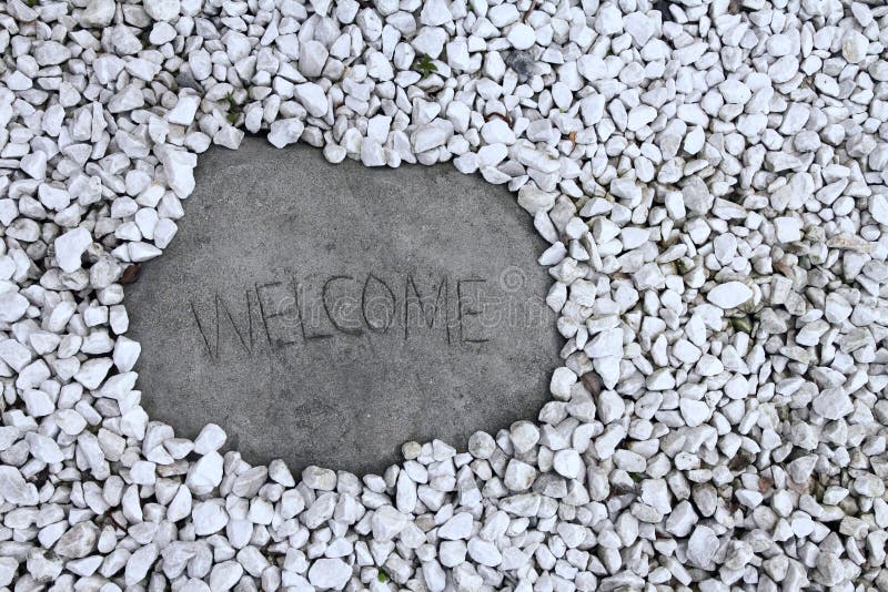 Welcome Sign Rock Surrounded by White Rocks Stock Photo - Image of ...