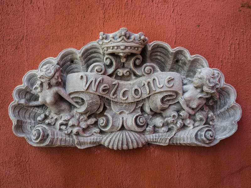 Welcome sign stone on wall stock image. Image of wall - 87286465