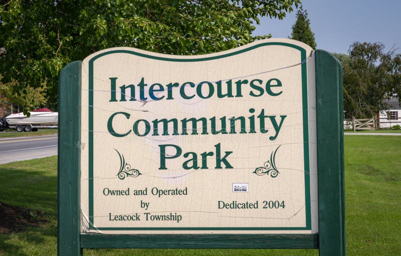 Welcome Sign To Intercouse, on the Road Next To Brushes and Grass on a ...