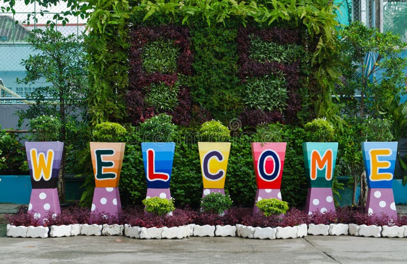 Welcome Sign Word on Flower Pots Stock Photo - Image of orange, board ...