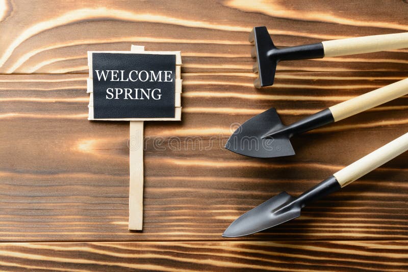 Welcome Spring Sign with Tools on Table Stock Photo - Image of growth ...