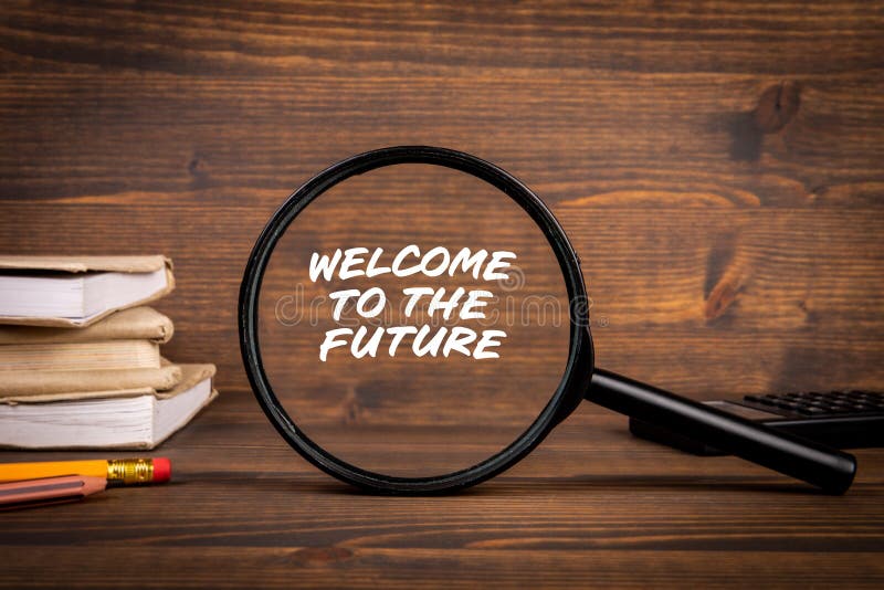 Welcome To the Future. Magnifying Glass and Stack of Books on Wooden ...