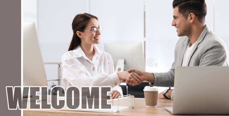 Welcome To Team. Employee Shaking Hands with Intern in Office Stock ...