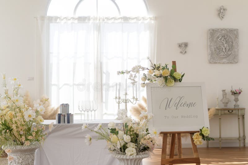 Welcome To Wedding Sign and Reception Table Decorated with Flowers ...
