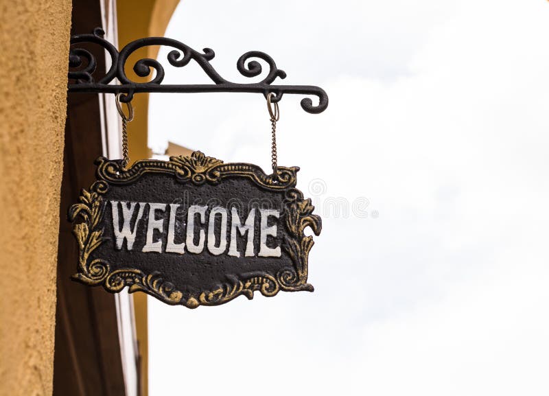 Welcome Wooden Sign Board with Rope Hanging in Front of the Gate Stock ...