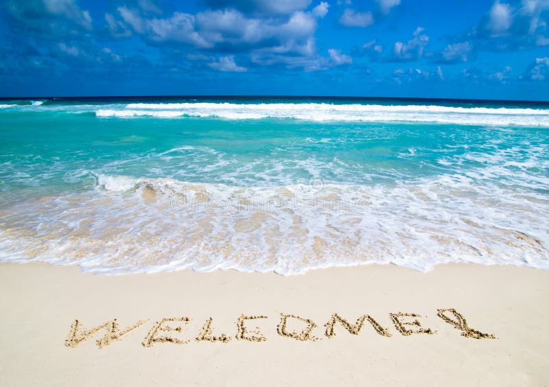 Welcome written in beach stock photo. Image of emotion - 29586654