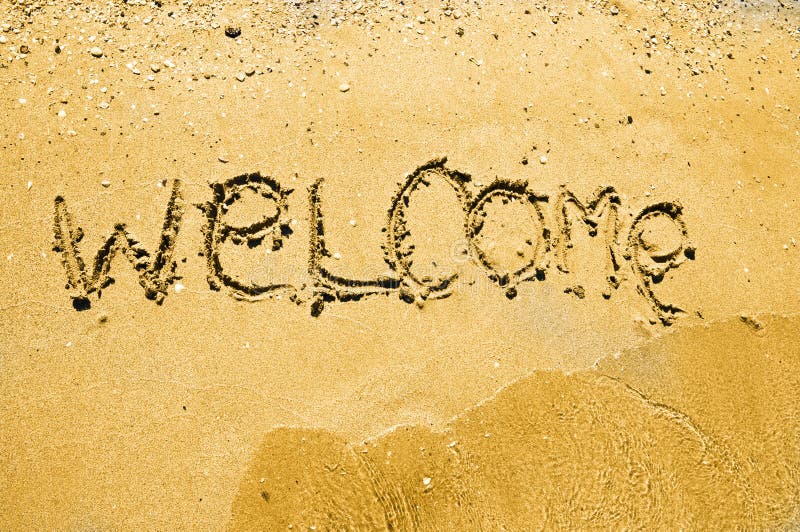 Welcome written on sand stock photo. Image of summer - 21648776