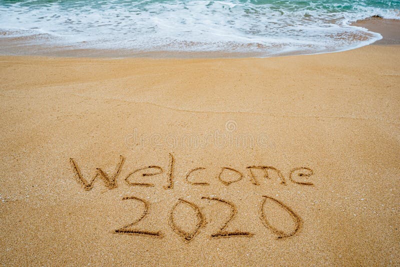 Welcome 2020 Written in the Sand Stock Photo - Image of printed, sandy ...