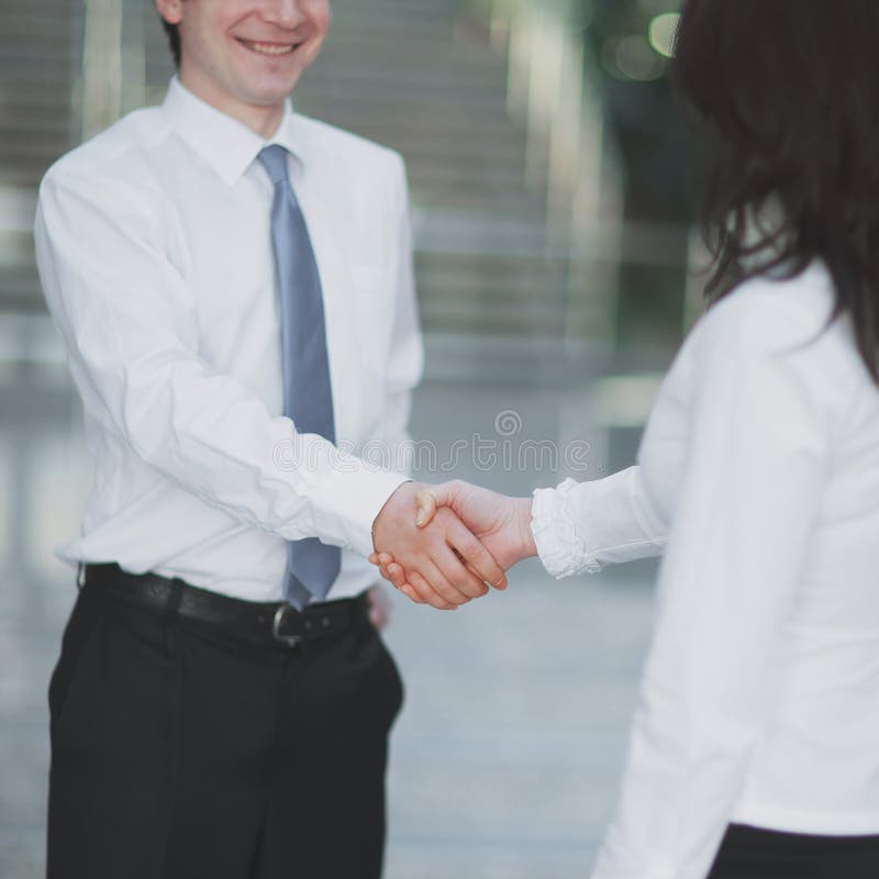 Welcoming Handshake of a Manager and the Customer in the Office. Stock ...