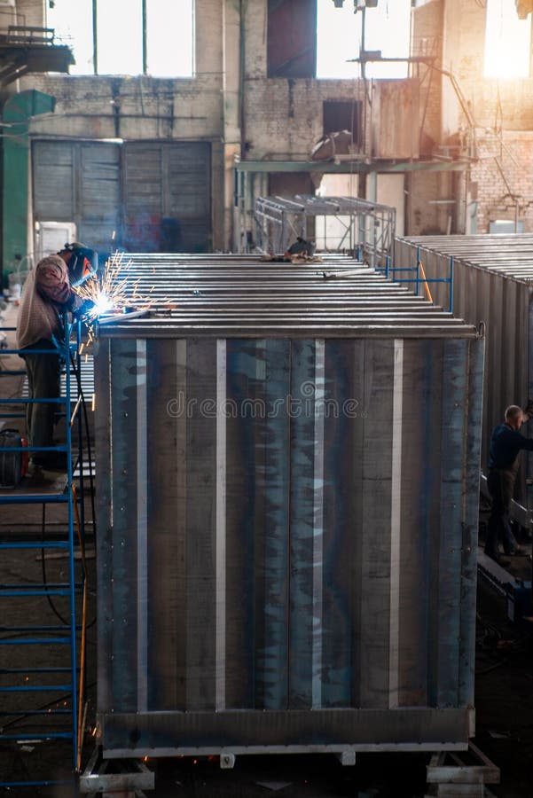 Welder Collects a Large Metal Container Stock Photo - Image of ...