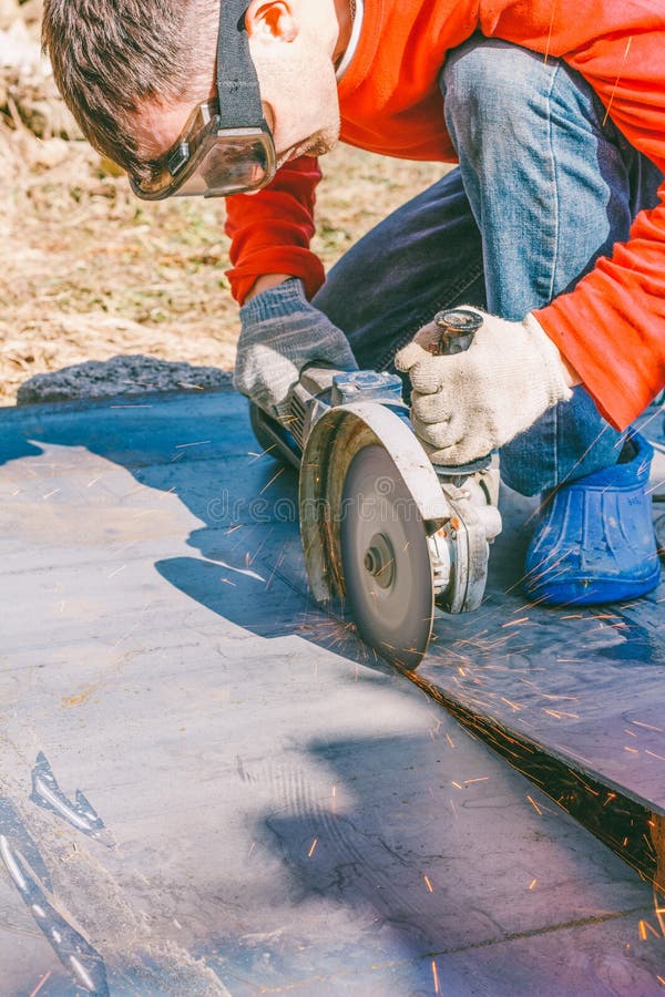 Welder cuts metal sheet stock image. Image of metalwork - 109384743