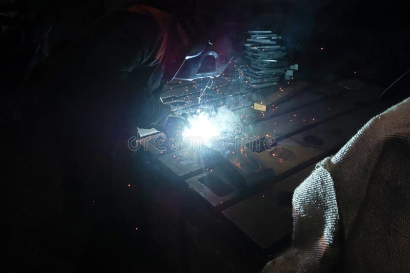 The Welder is Engaged in Performing Welding Work with the Help of ...