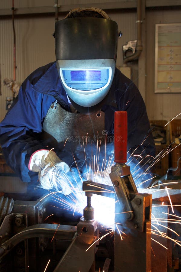 Welding a Car Part in Factory Stock Image - Image of fumes, blue: 5289675