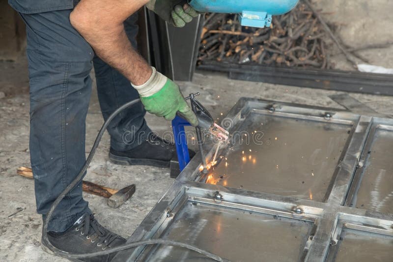 A Welder Fixing a New Metal Gate Stock Photo - Image of fire, skilled ...