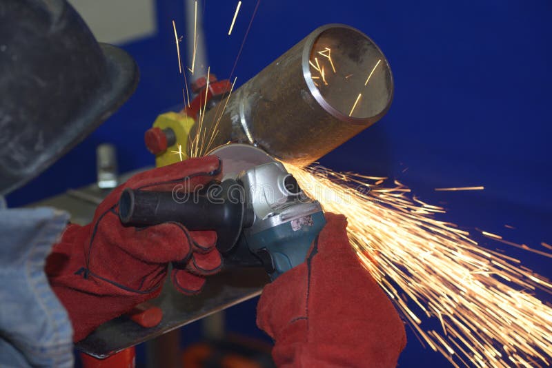Welder Hands Grinding Metal Piece with a Grinder, Processing Weld after ...