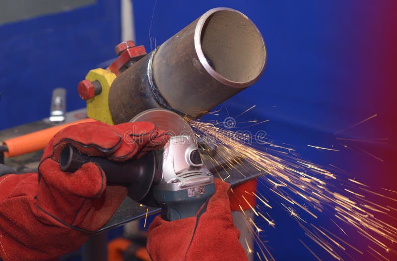 Welder Hands Grinding Metal Piece with a Grinder, Processing Weld after ...