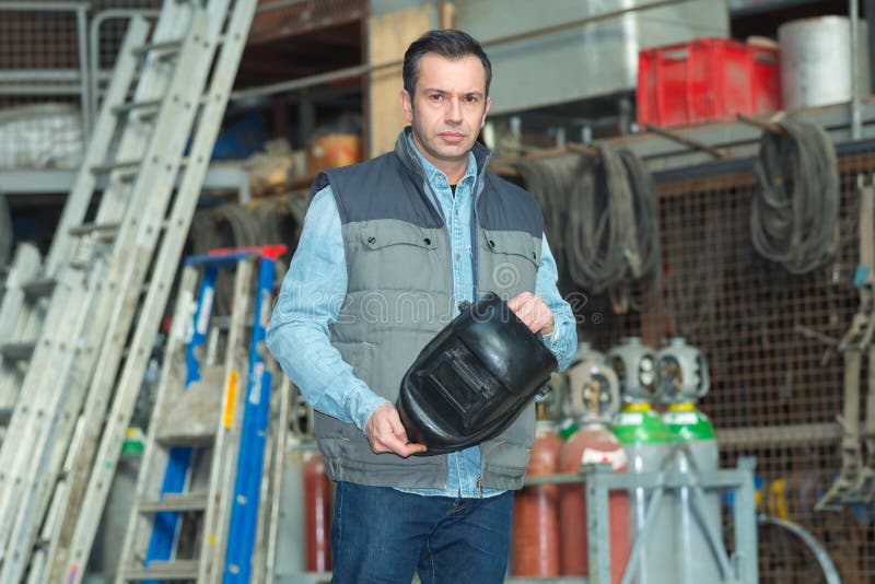 Welder looking at factory stock photo. Image of engineering - 250114110