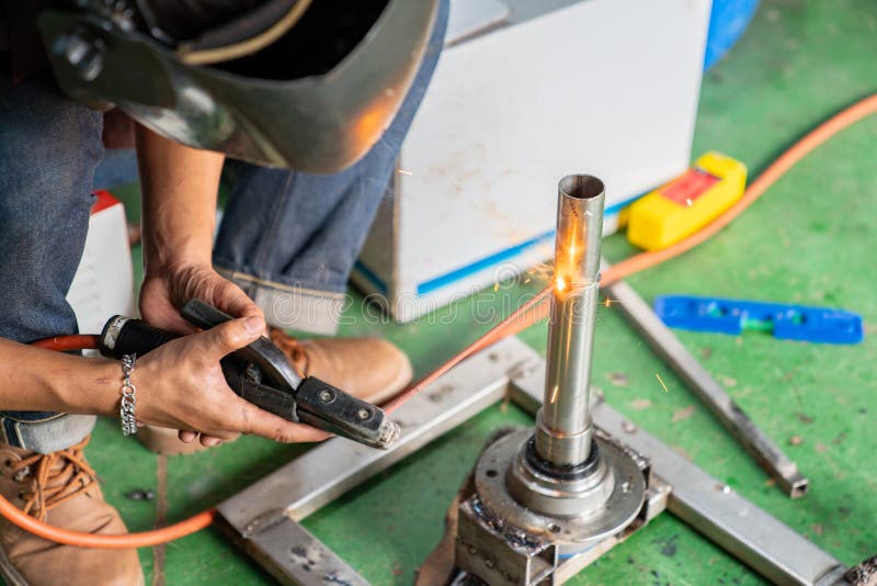 A Welder Makes a Precision Weld on a Stainless-steel Element Stock ...
