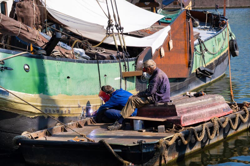 Welder Man Working on a Ship Hull Editorial Photography - Image of ...