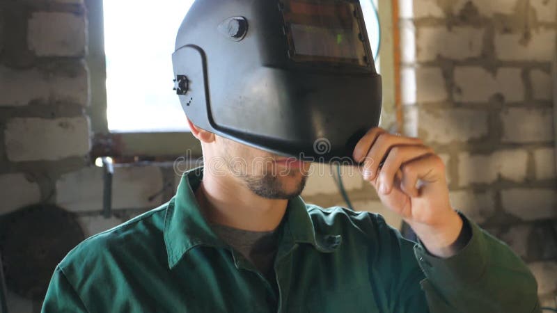 Welder Opens Mask and Looking at Camera. Portrait of Handsome Man with ...