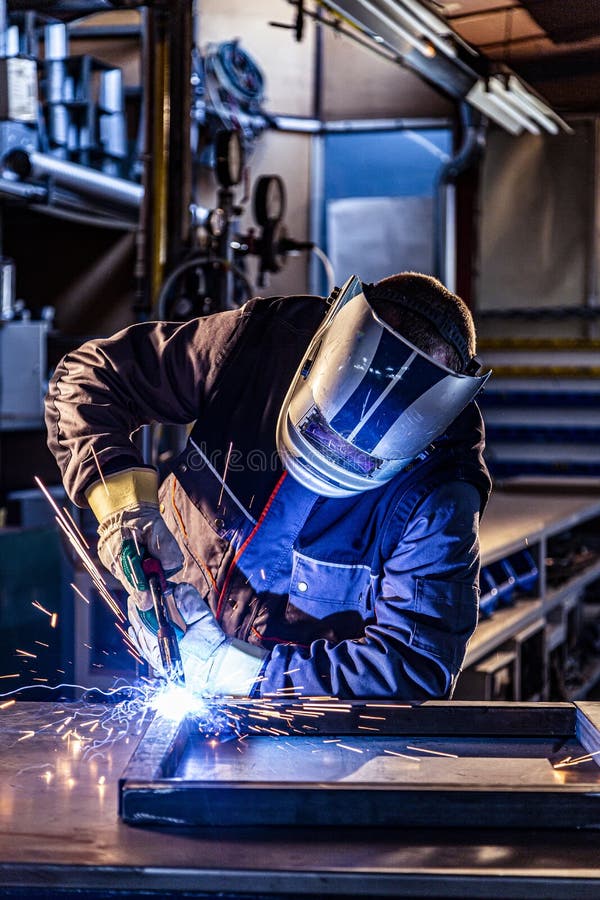 A Welder Welding in Factory Stock Image - Image of machine, handyman ...