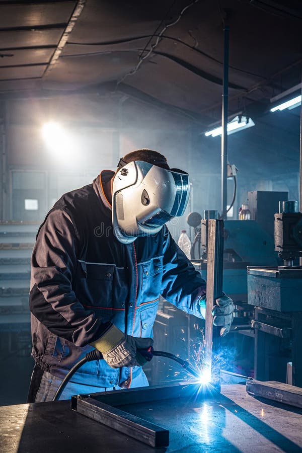 A Welder Welding in Factory Stock Photo - Image of metal, factory ...